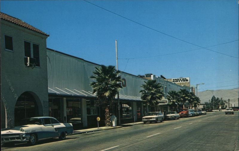 Indio, California - Street Scene with Motel Sign Merle Porter Postcard