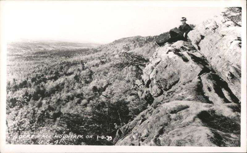 Man on Rocky Face Mountain overlooking forested valley Georgia Postcard