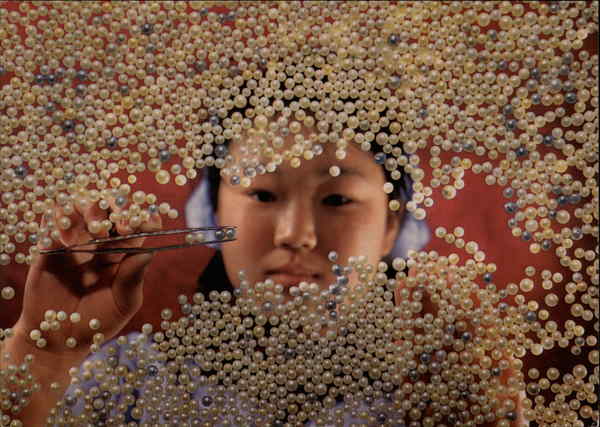 Woman Sorting Pearls Asian