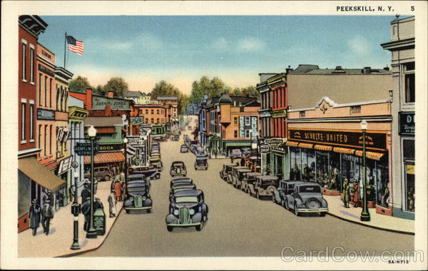 Cars driving up and down Main Street Peekskill, NY Postcard