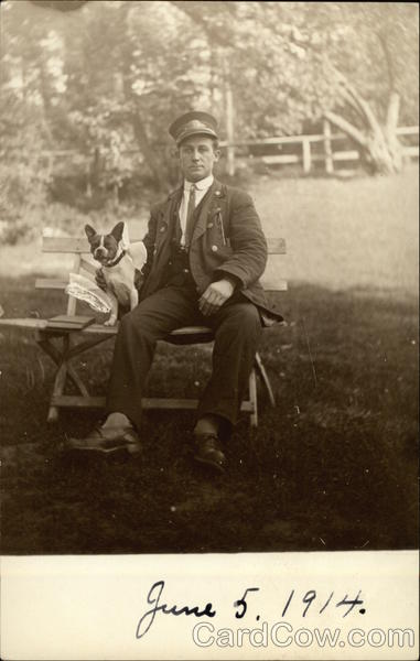 Postman or Train Conductor and his Dog in 1914 Dogs Postcard