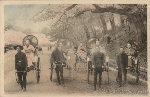 Women taking a ride on hand-pulled rickshaws Japan