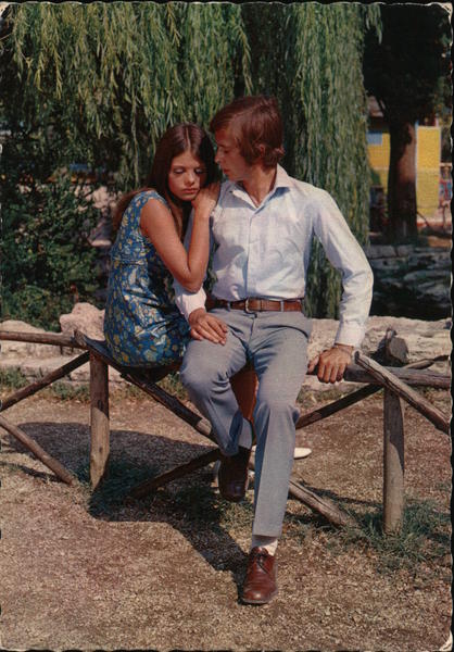 1960's Morose Girl and a Snazzy Boy Sitting on a Fence Couples Postcard