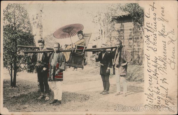 Woman in Traditional Japanese Attire Sitting in Sedan Chair with ...